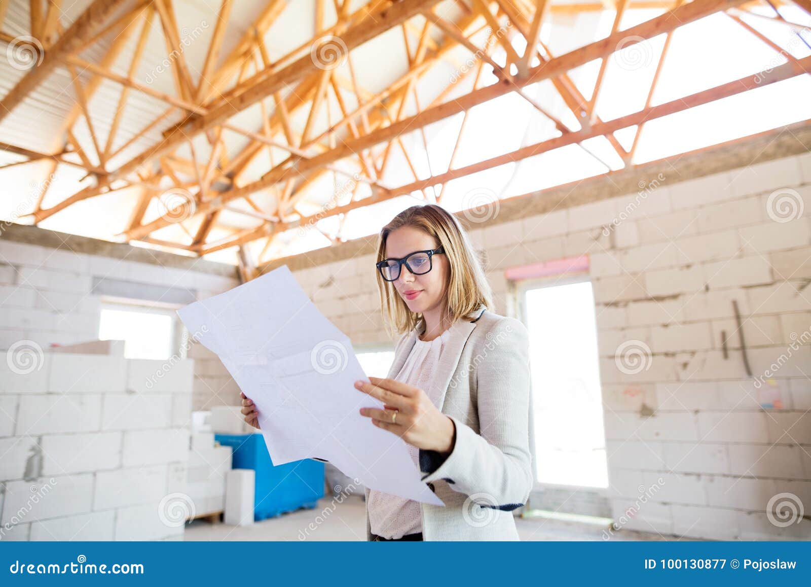 Architect at the Construction Site Looking at Blueprints. Stock Image ...