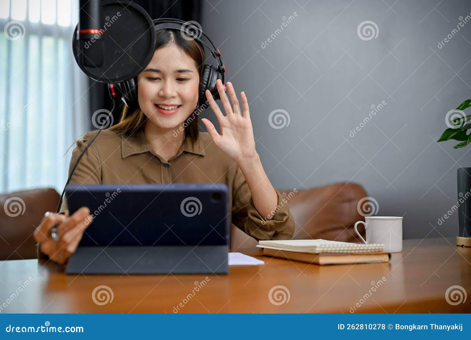 Beautiful Asian Female Radio Host Running Her Radio Show Or Podcasting