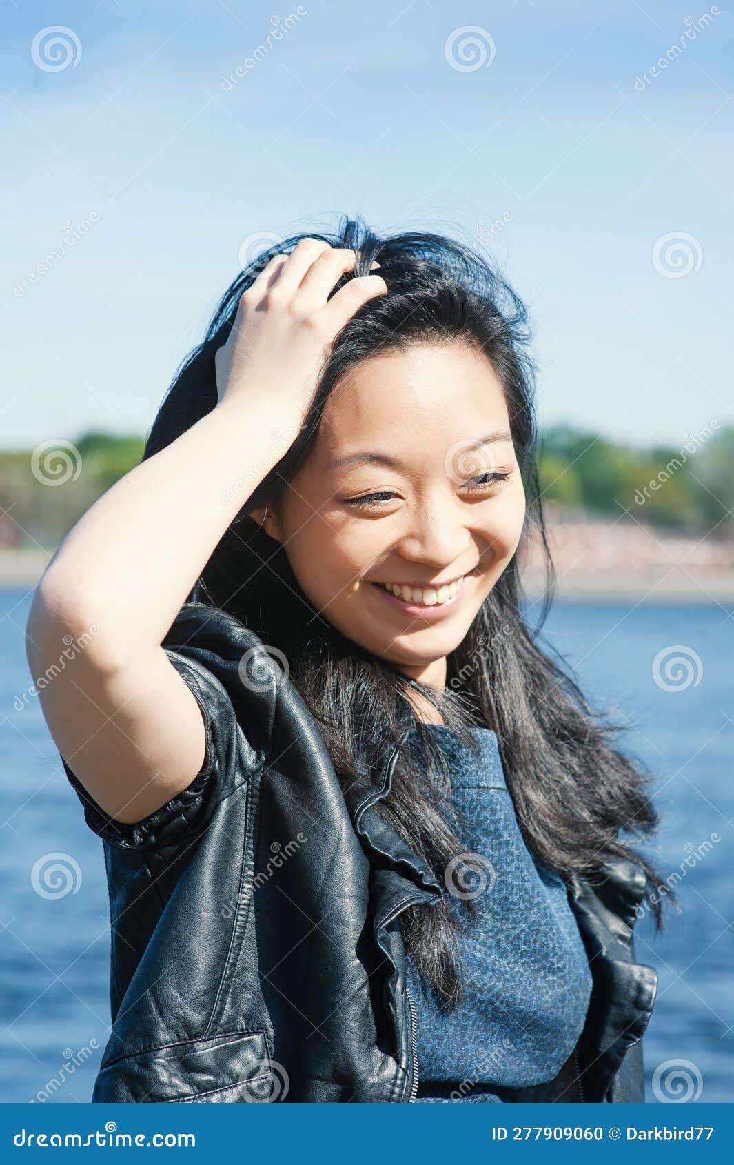 Beautiful Young Asian Woman Smiling In The City At Sunny Day Stock
