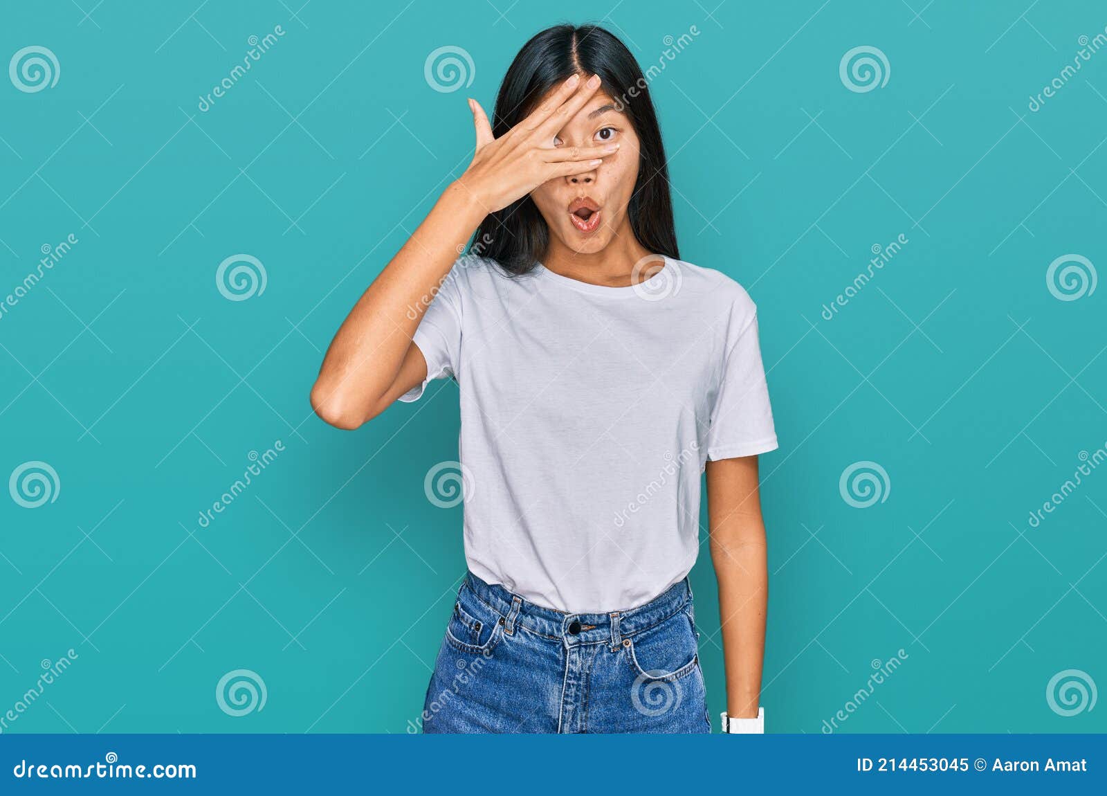 Beautiful Young Asian Woman Wearing Casual White T Shirt Peeking In