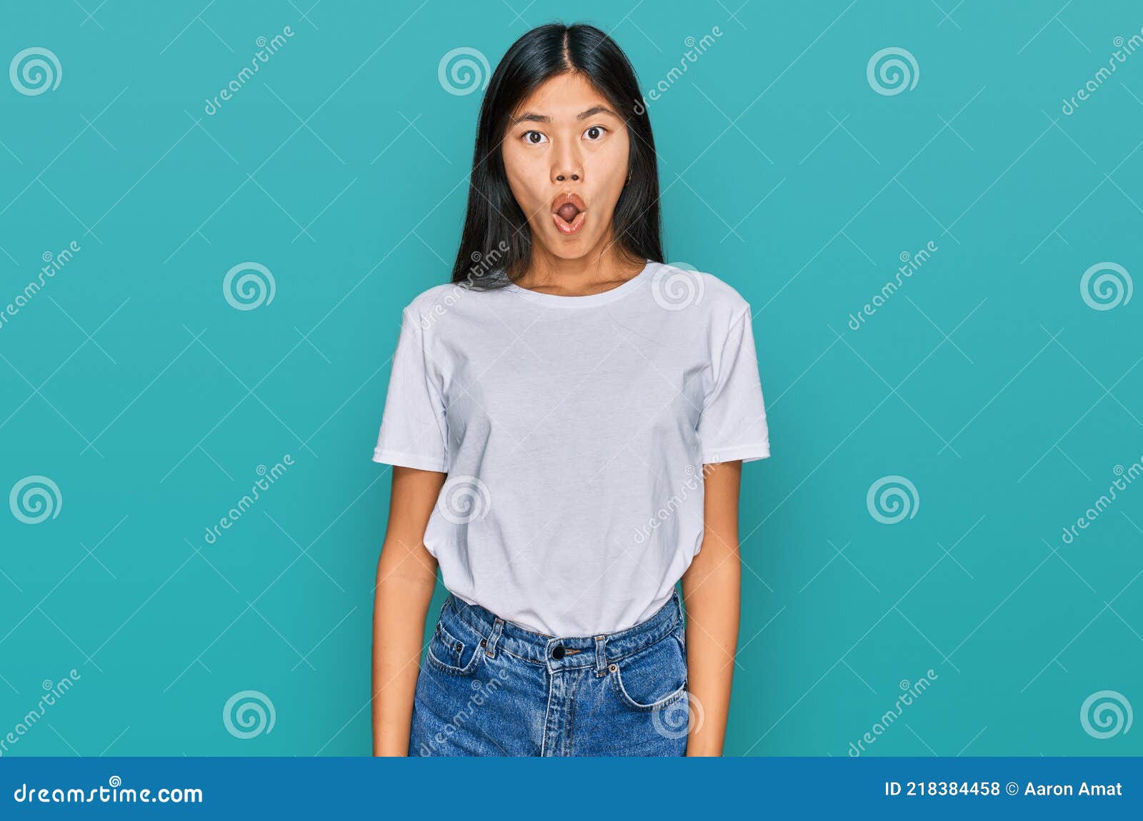 Beautiful Young Asian Woman Wearing Casual White T Shirt In Shock Face