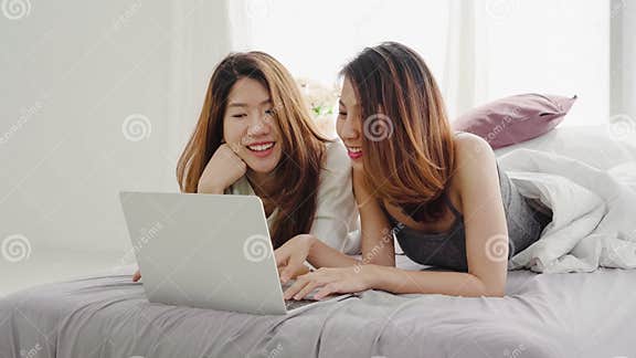 Beautiful Young Asian Women Lgbt Lesbian Happy Couple Sitting On Bed
