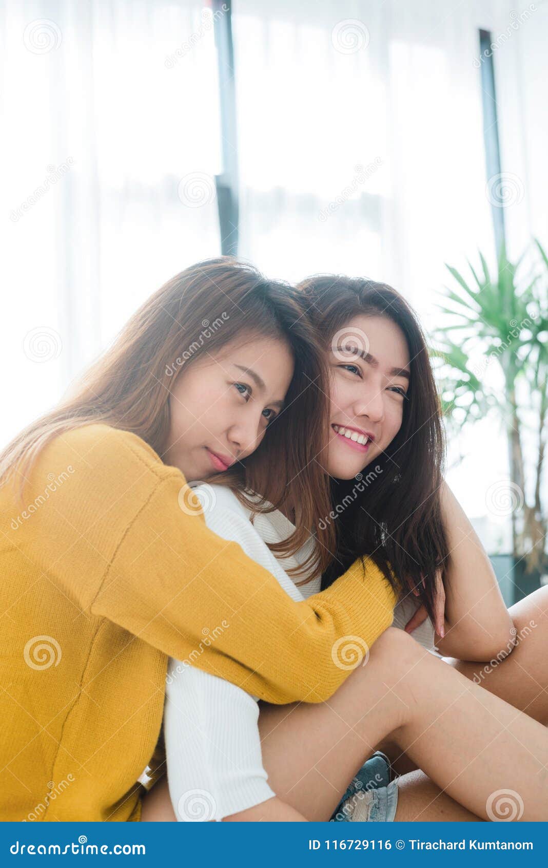 Beautiful Young Asian Women Lgbt Lesbian Couple Sitting On Bed Hugging