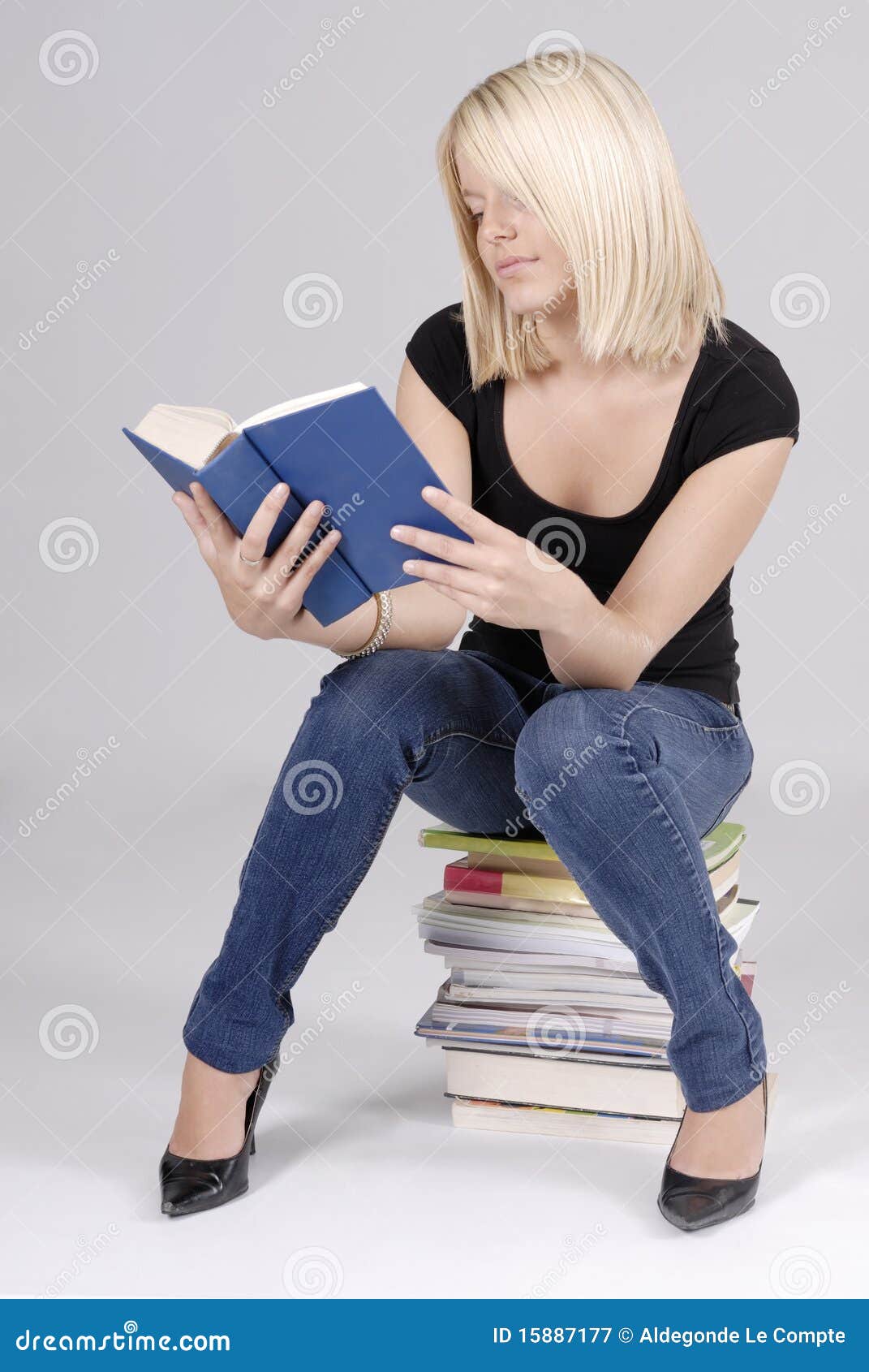 Beautiful Young Blond Student Sitting on Books Stock Image - Image of ...