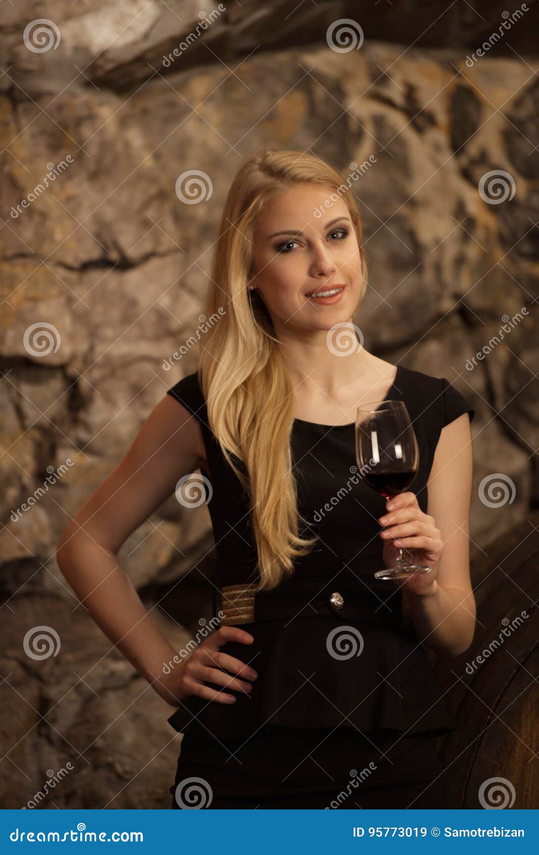 Beautiful Young Blond Woman Drinks Wine in Wine Cellar Stock Image ...