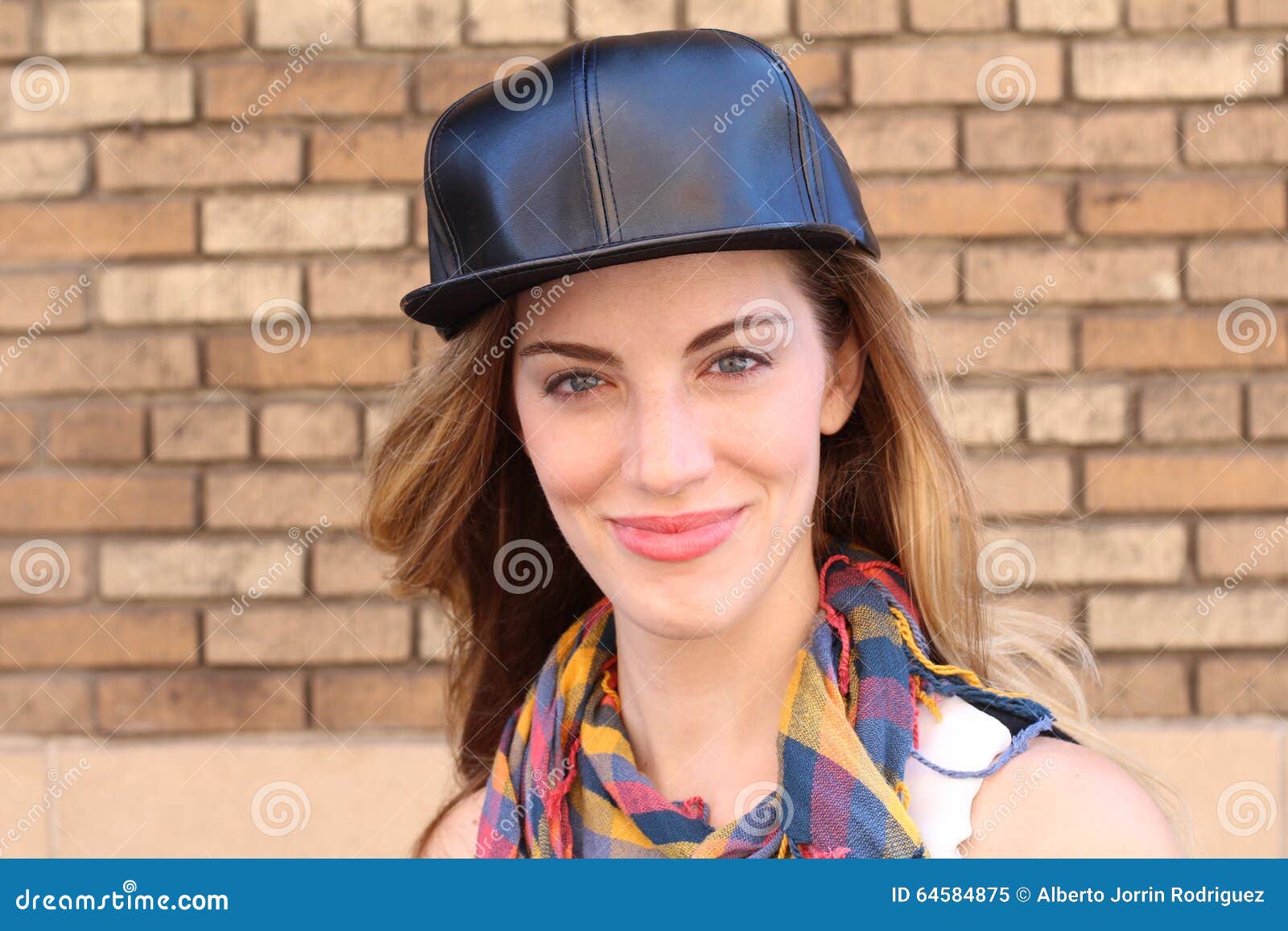 A Beautiful Young Blonde Girl in a Cap Poses Stock Image - Image of ...