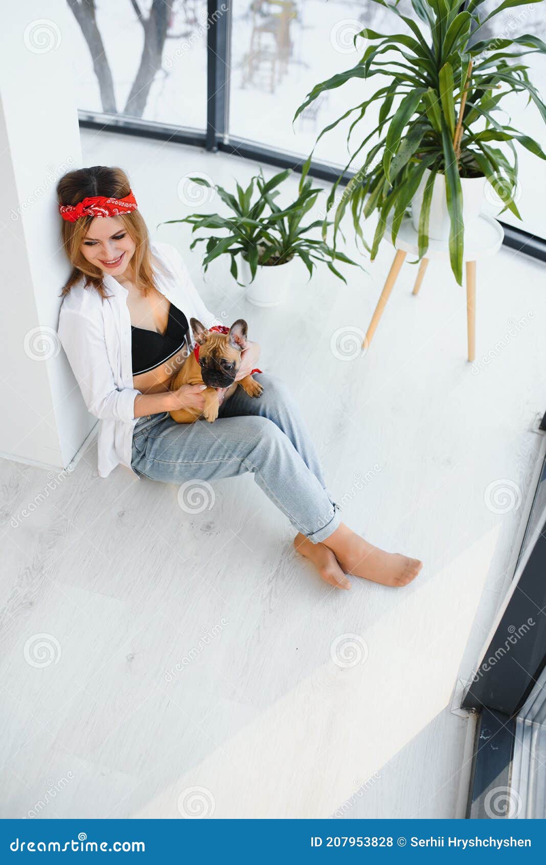 Beautiful Young Blonde Woman Playing with Her Dog at Home, Smiling ... Beautiful Young Blonde Woman Playing with Her Dog at Home, Smiling ...