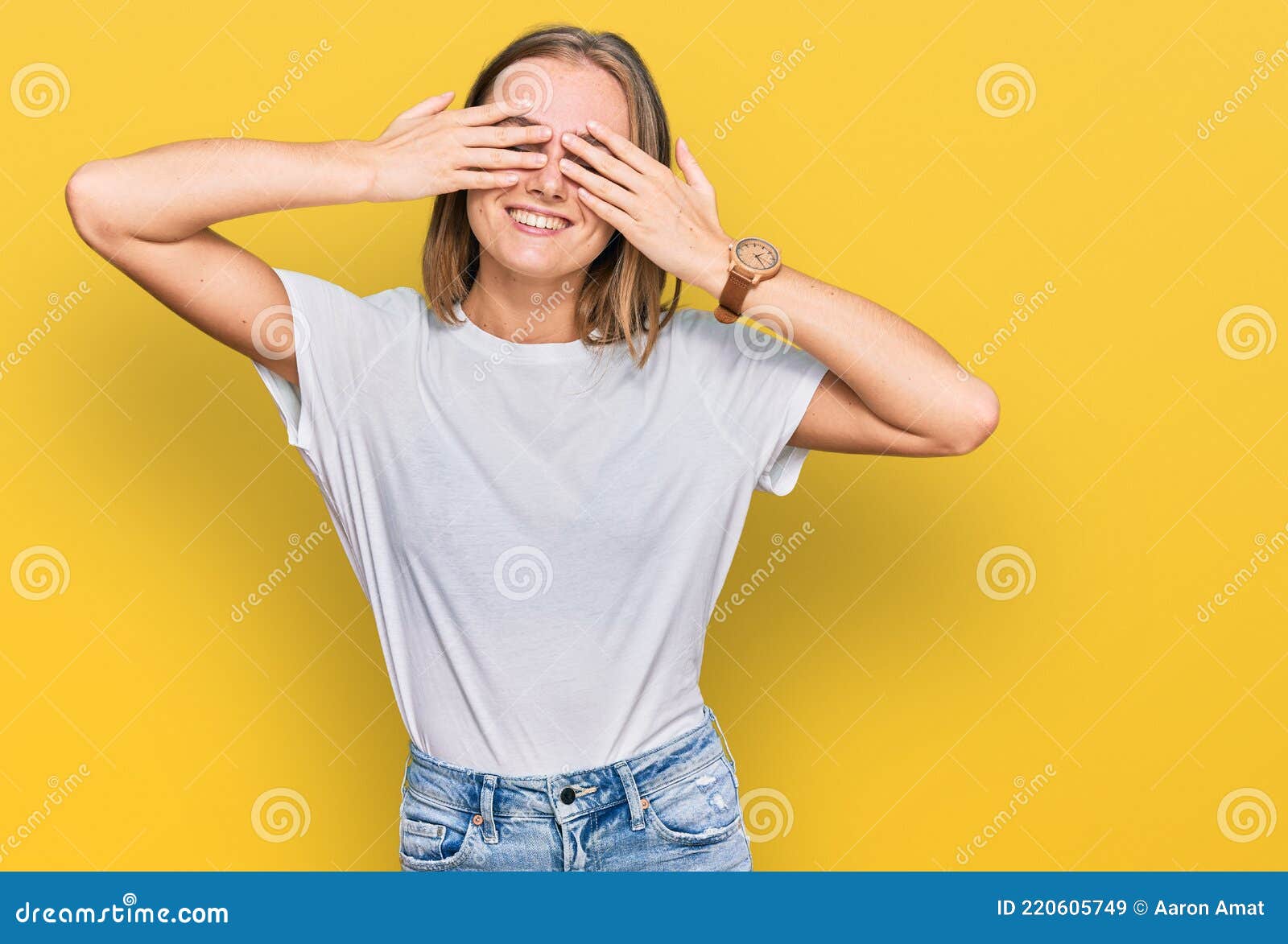 Beautiful Young Blonde Woman Wearing Casual White T Shirt Covering Eyes