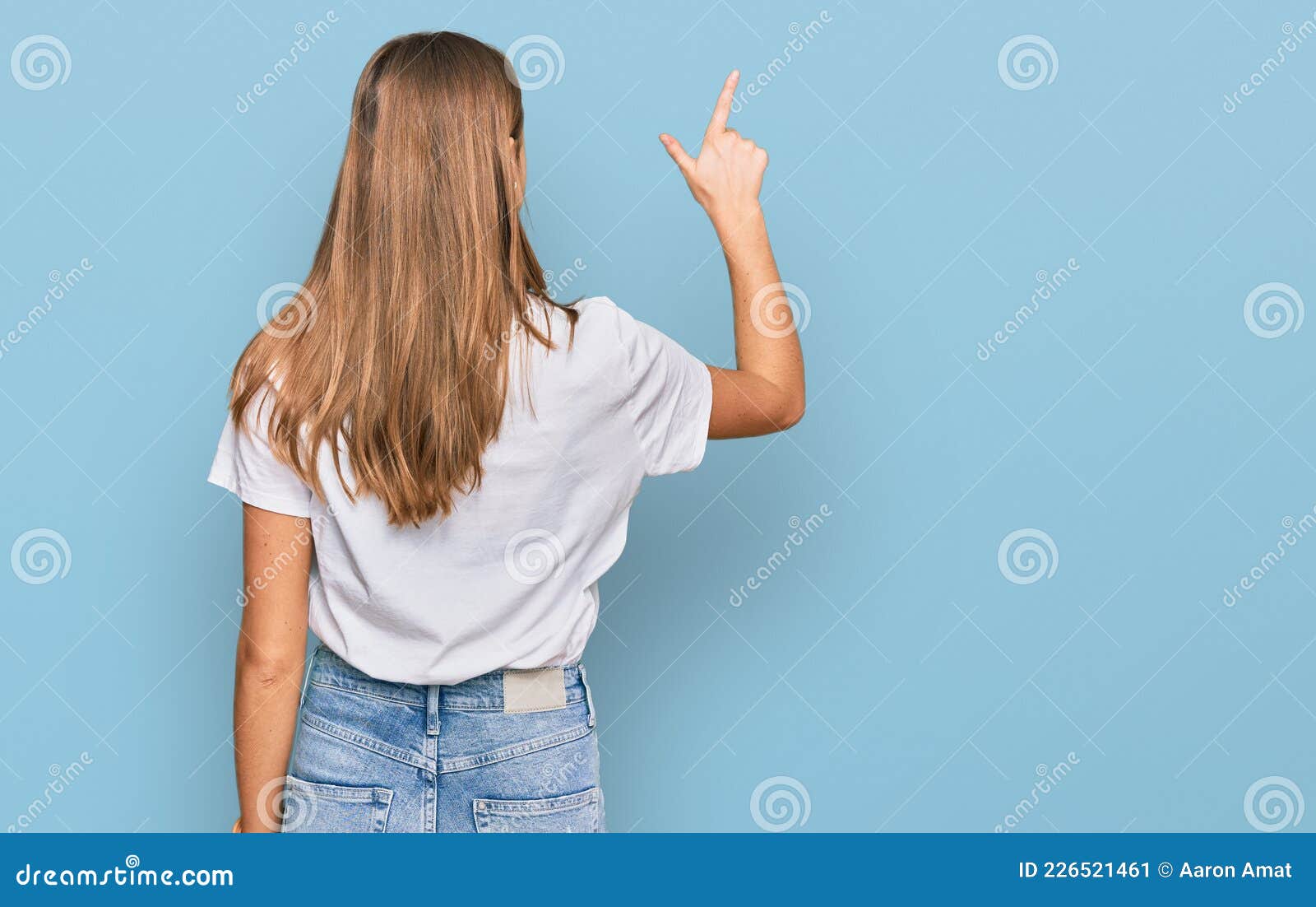 Beautiful Young Blonde Woman Wearing Casual White T Shirt Posing