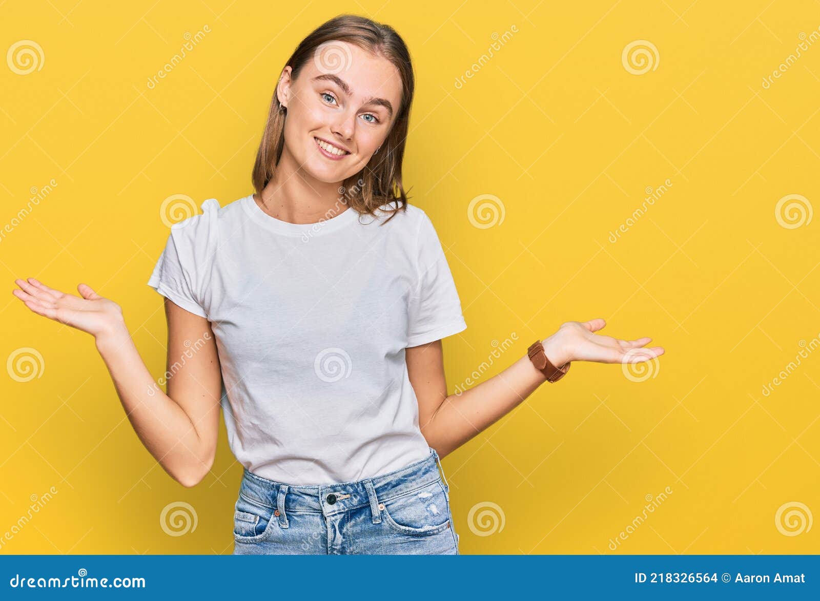 Beautiful Young Blonde Woman Wearing Casual White T Shirt Smiling