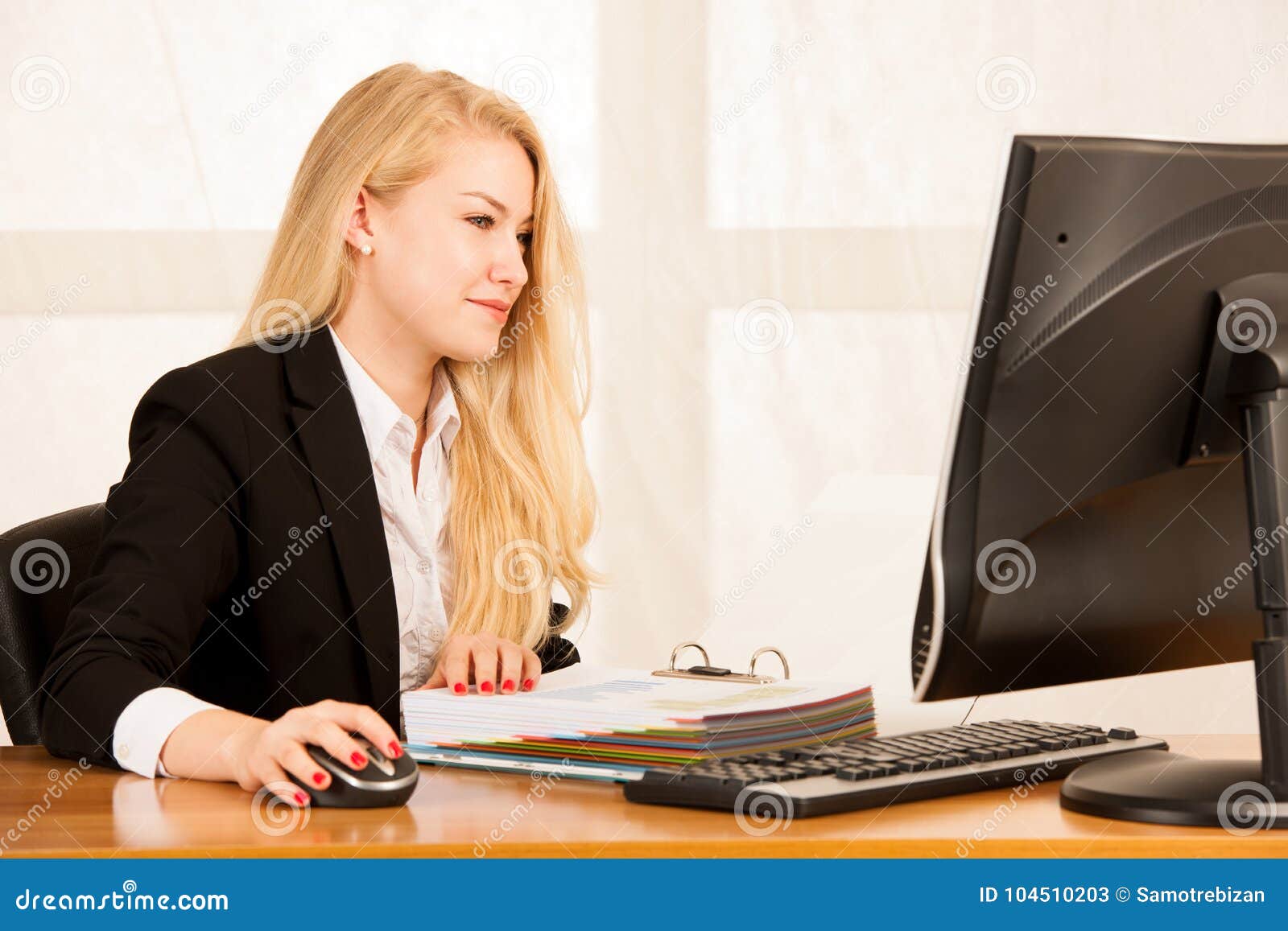 Beautiful Young Blonde Woman Working on Computer in Her Office Stock ...