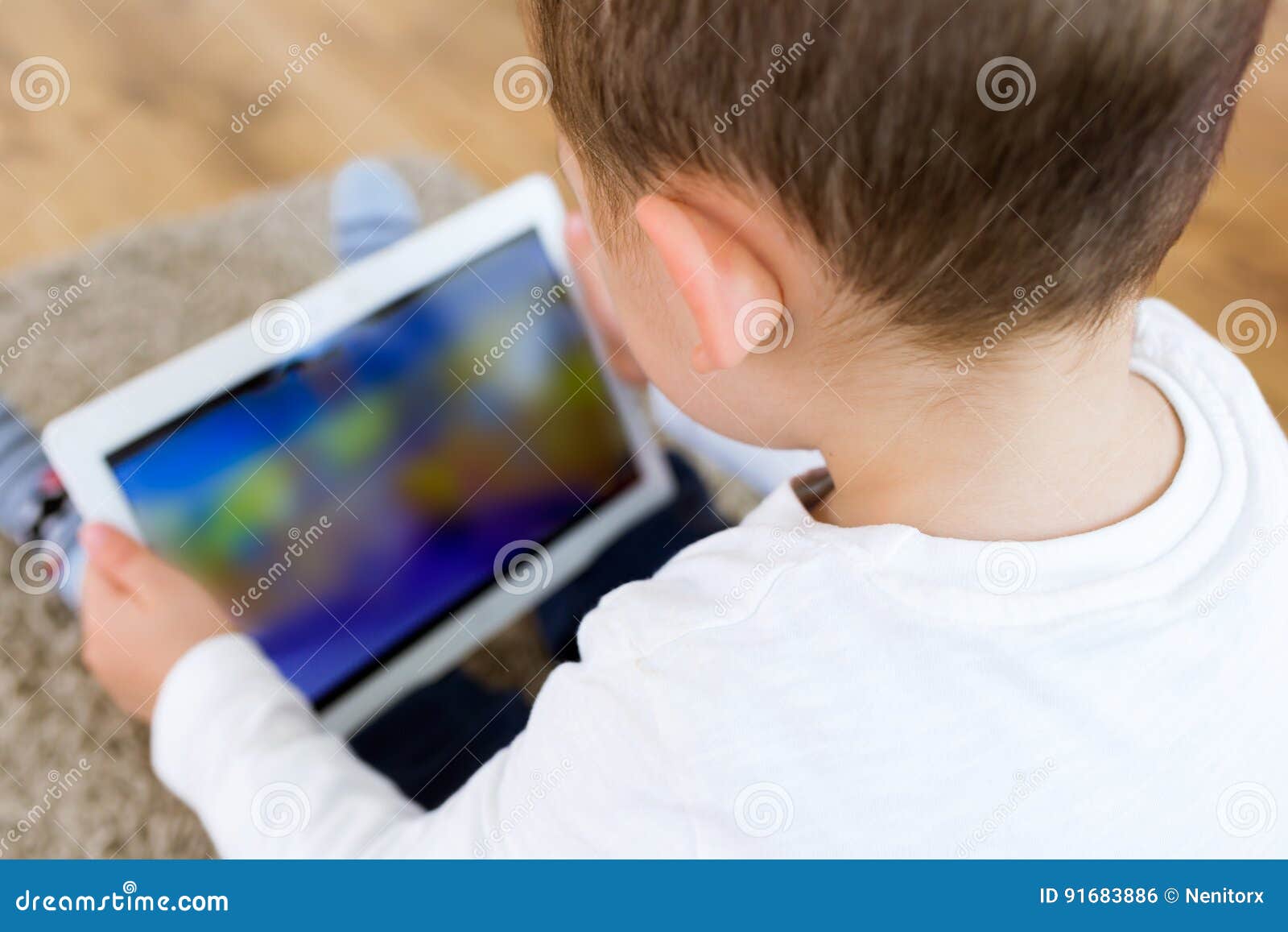 Beautiful Young Boy Using His Digital Tablet at Home. Stock Photo ...