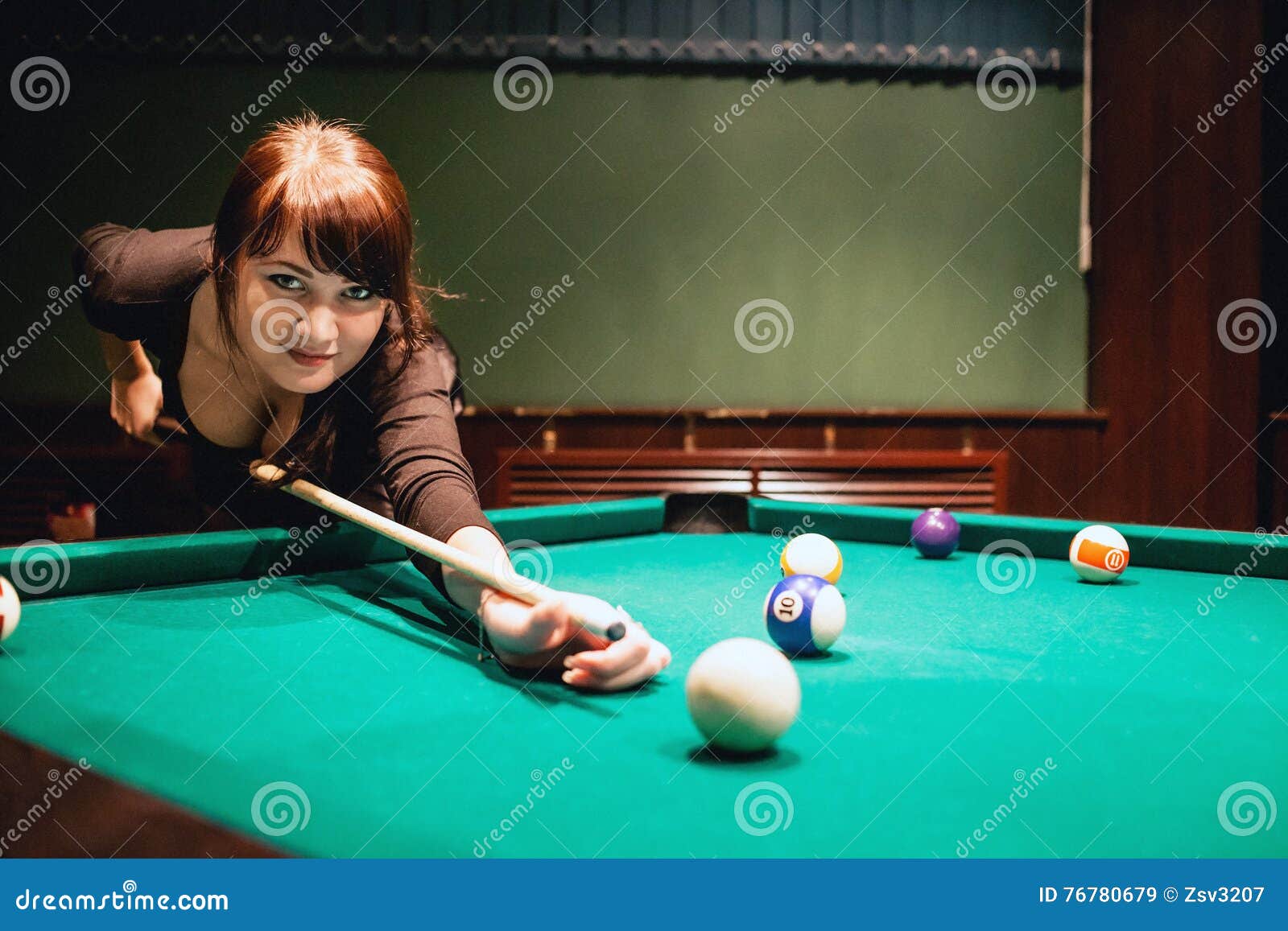 Beautiful Young Busty Brunette Woman Playing Billiard On Red Table