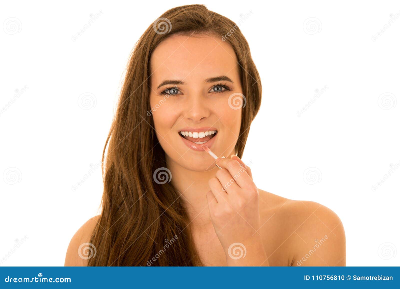 Beautiful Young Caucasian Brunette Woman Applying Lip Gloss On H Stock