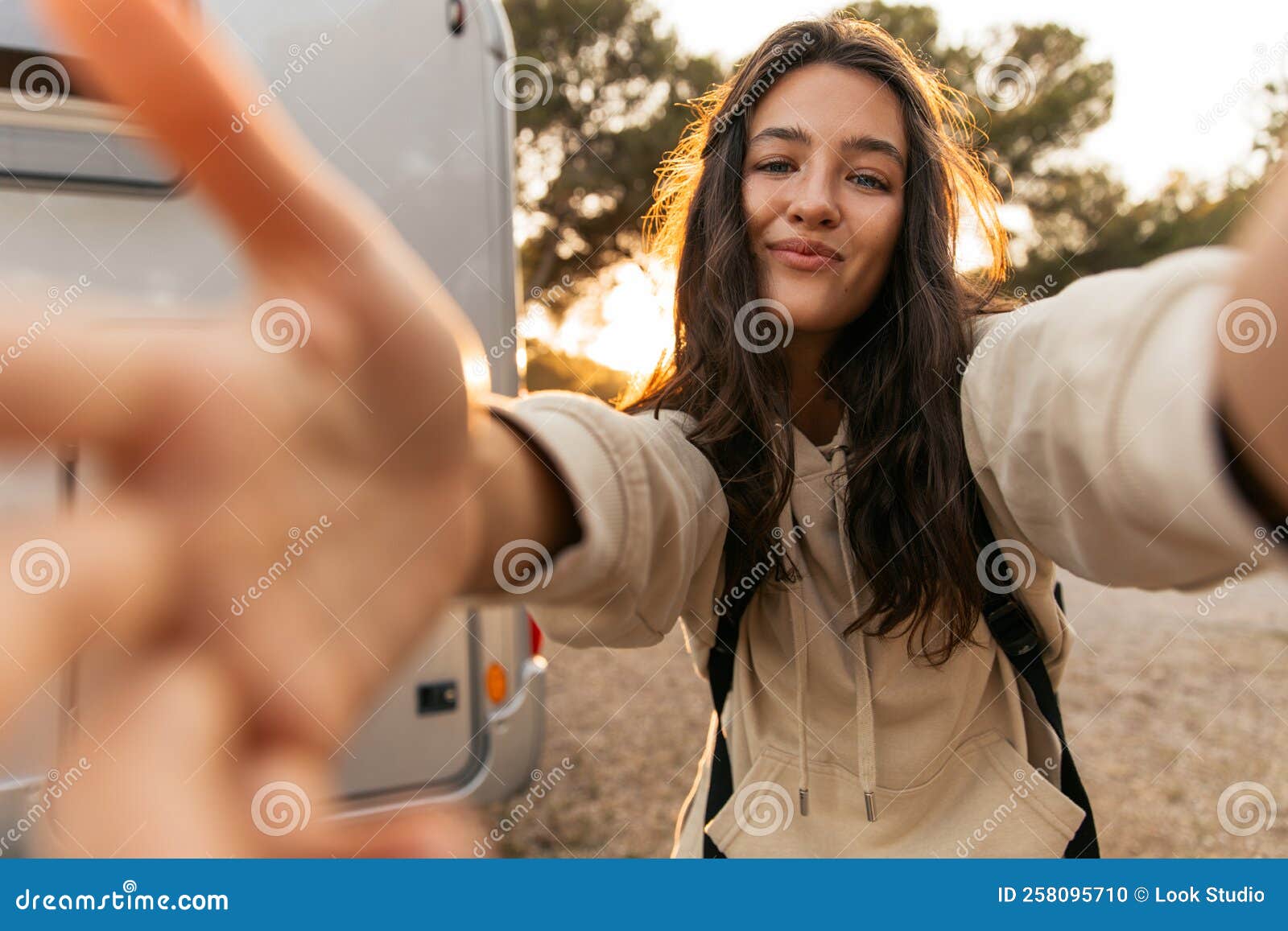 Beautiful Young Caucasian Girl Looks Into Camera Stretches Her Hands