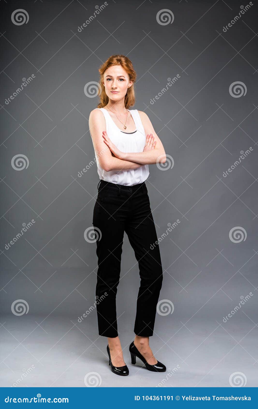 Beautiful Young Caucasian Woman With Long Red Hair In High Heels Black
