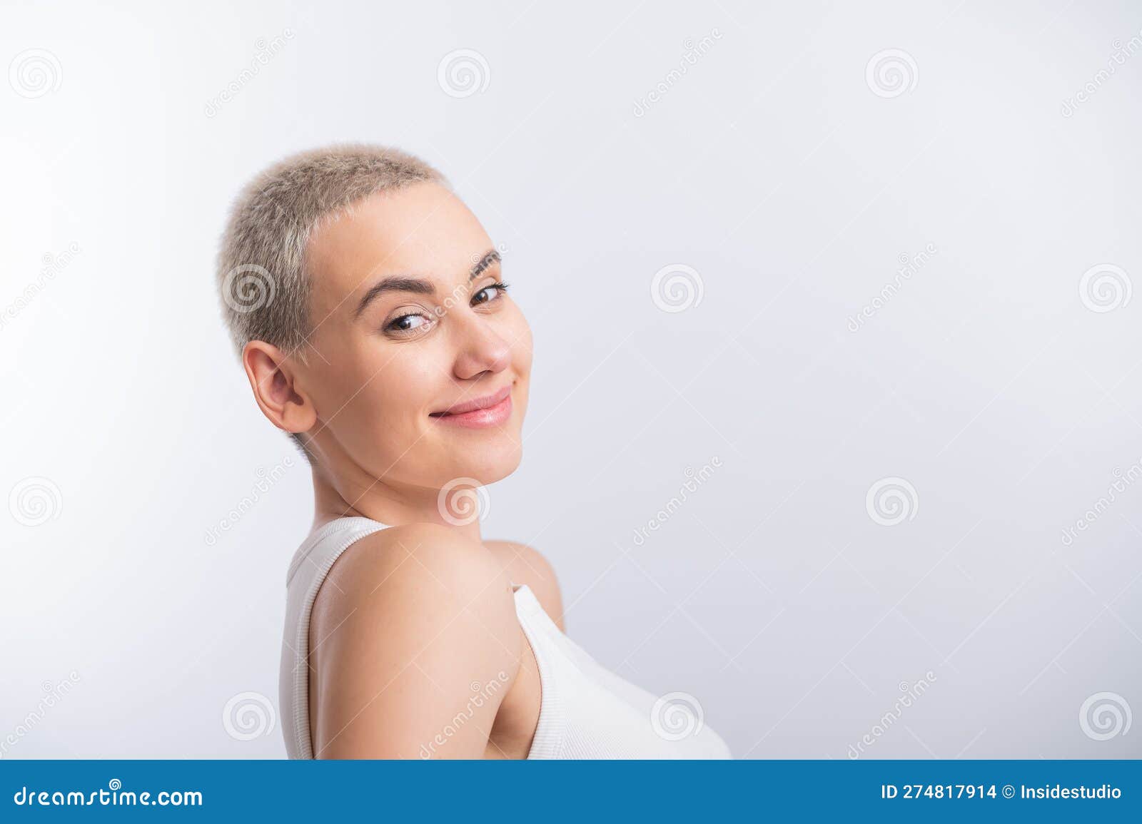 Beautiful Young Caucasian Woman With A Short Haircut On A White