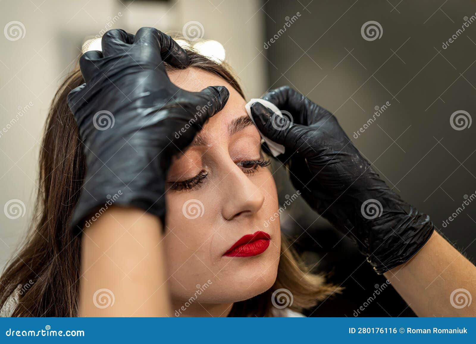 Beautiful Young Client is Wiping Her Eyebrows after Painting Them ...