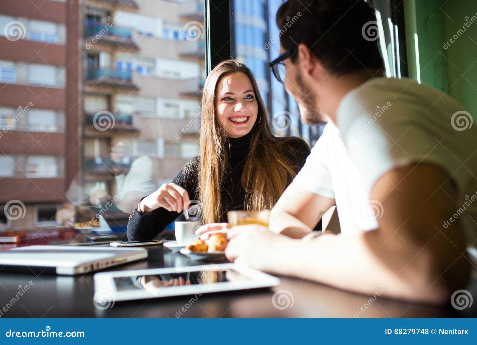 Beautiful Young Couple Having a Break Time in the Coffee. Stock Photo ...