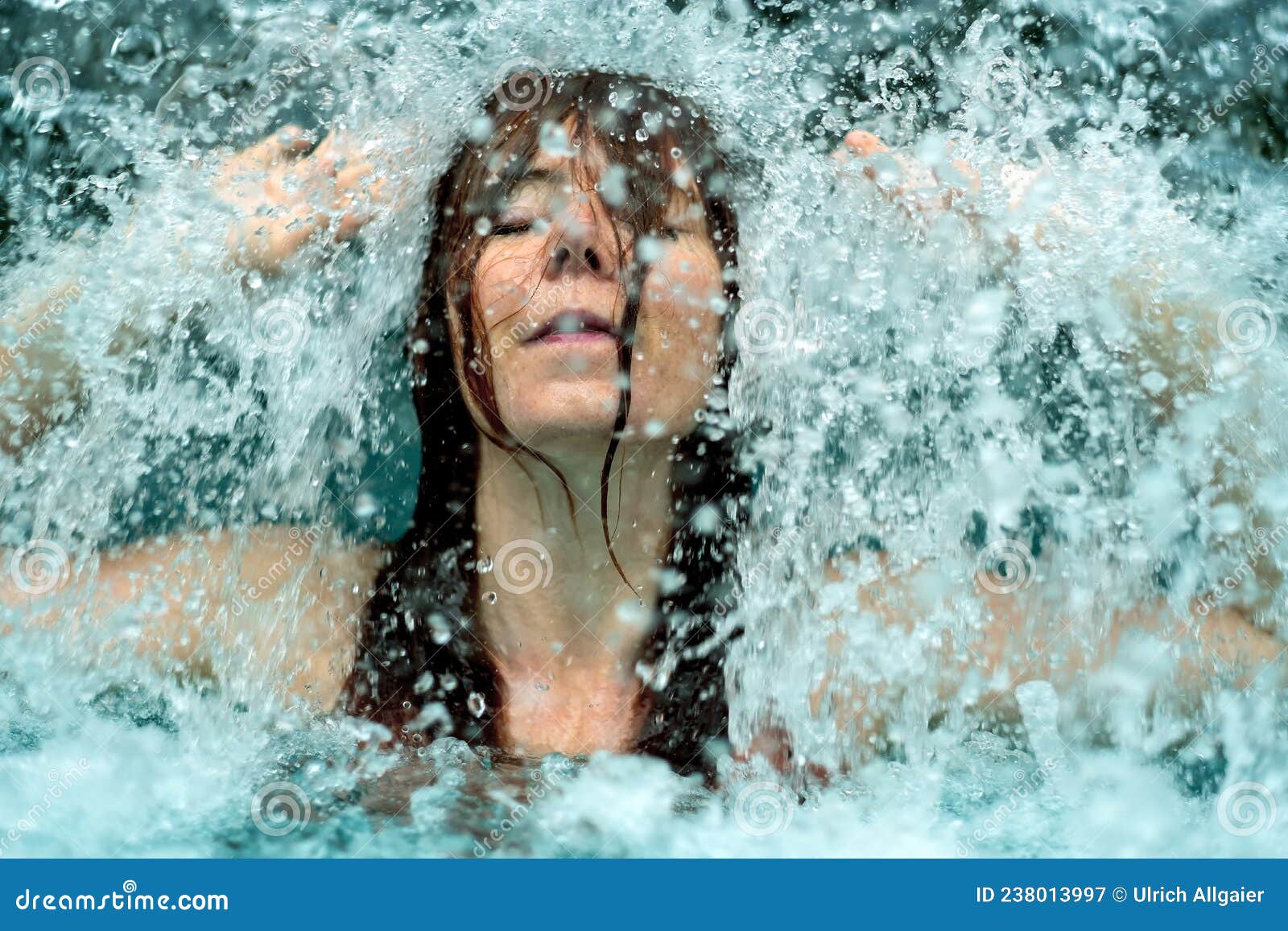 Beautiful Young Cute Redhead Woman Under The Splashing Falling Water