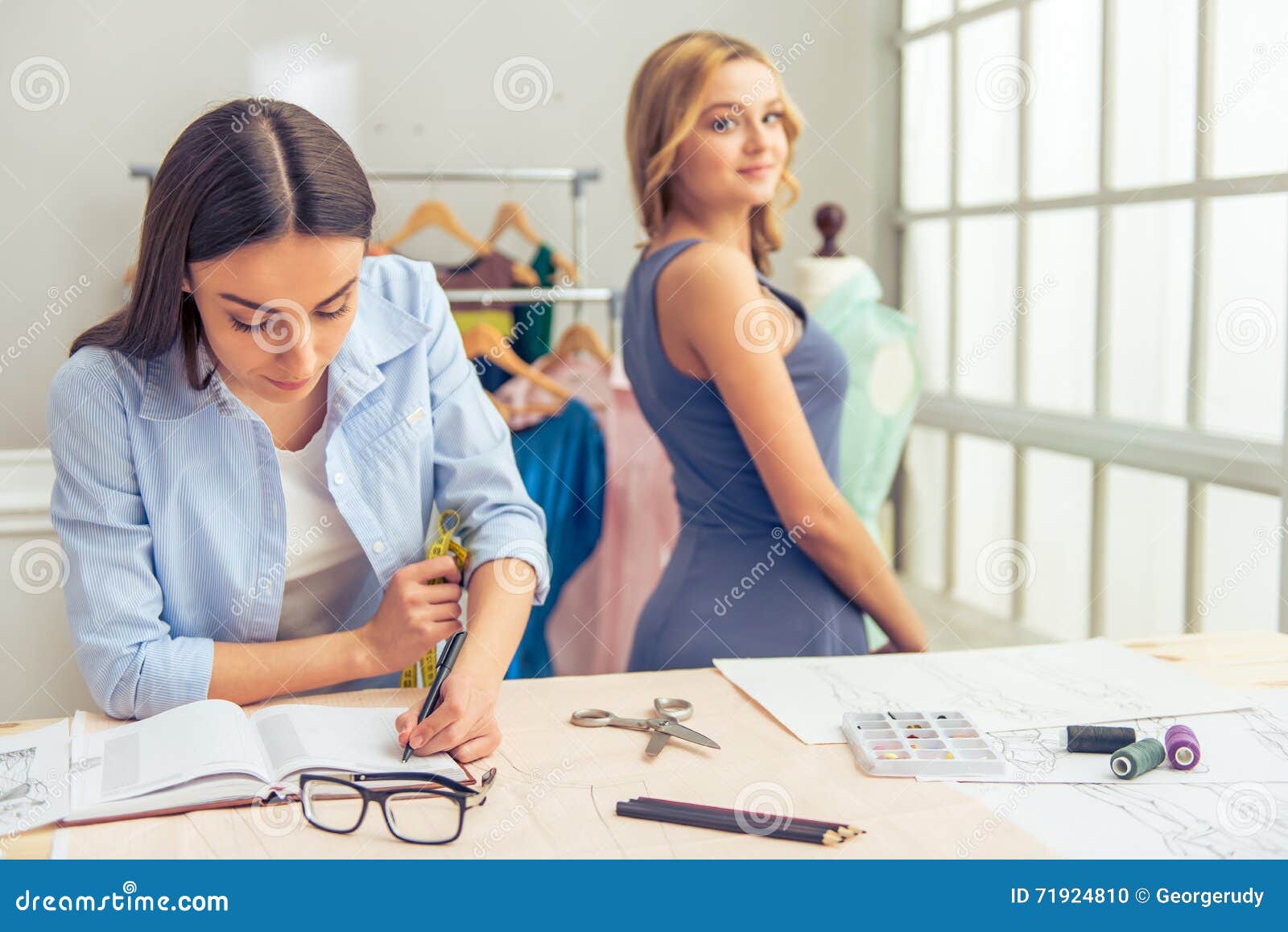 Beautiful Young Designer and Client Stock Photo - Image of material ...