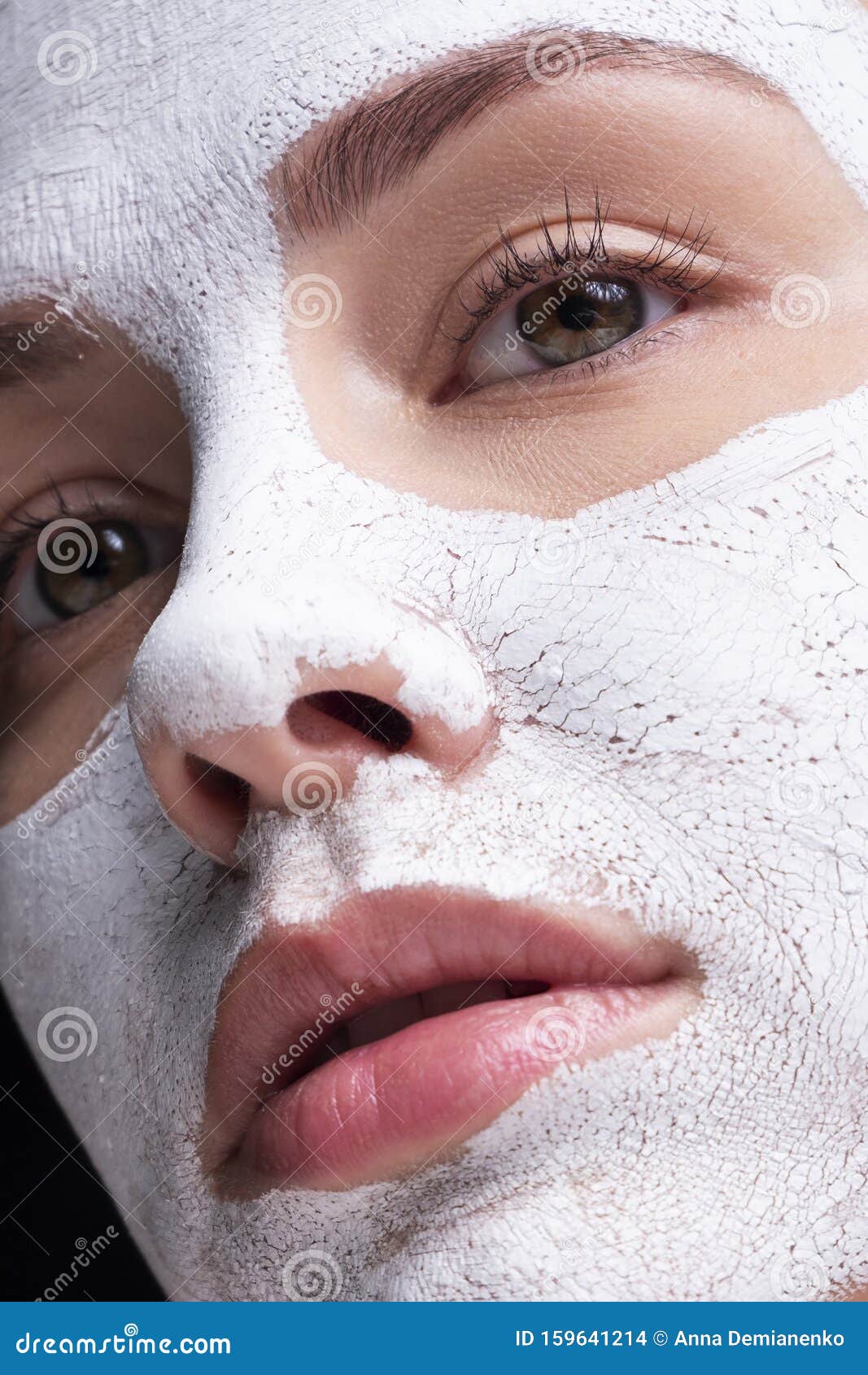 Beautiful Young European Woman Apply Clay Mask On Her Face Beauty Spa