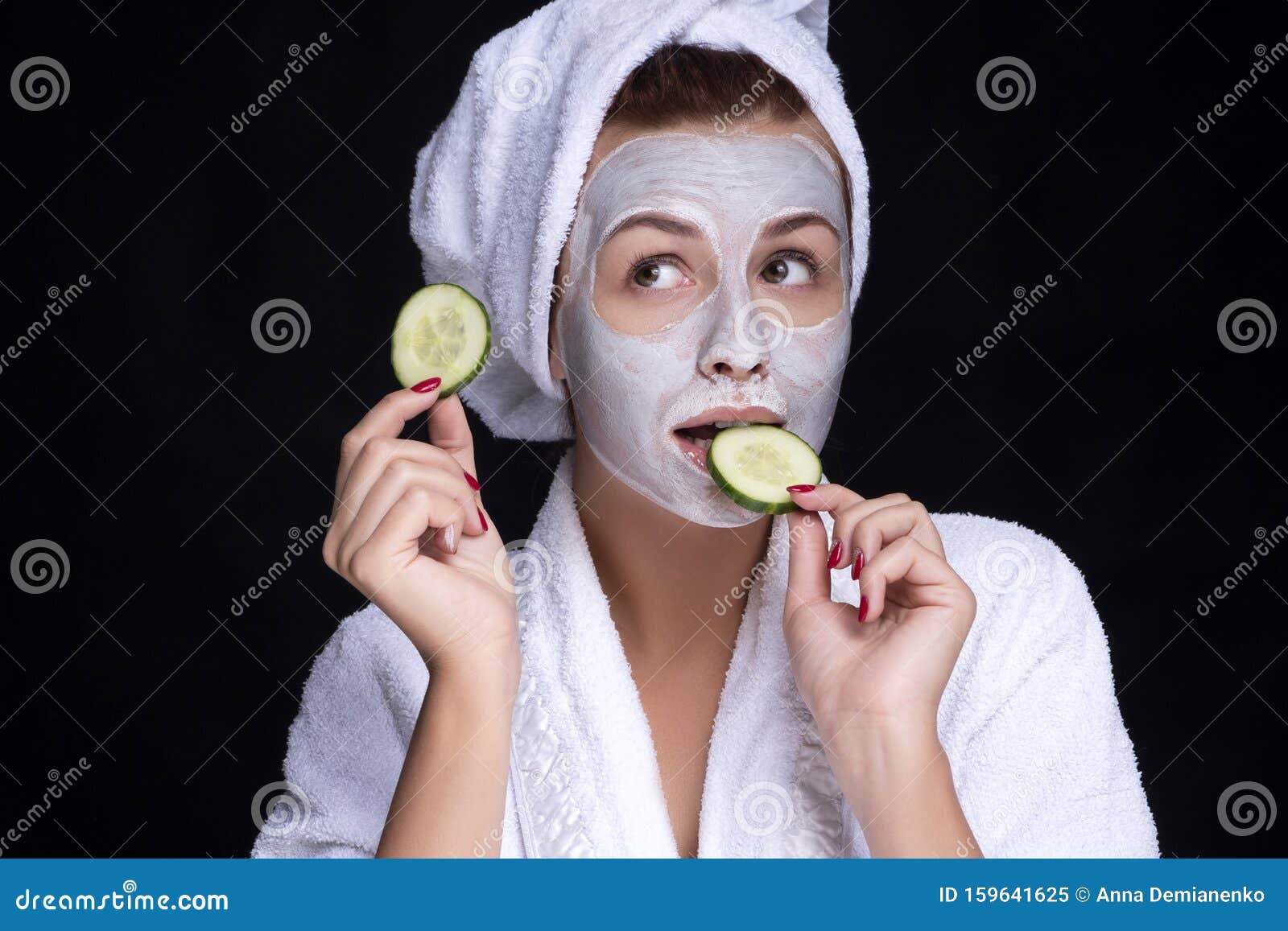 Beautiful Young European Woman Apply Clay Mask On Her Face With Towel