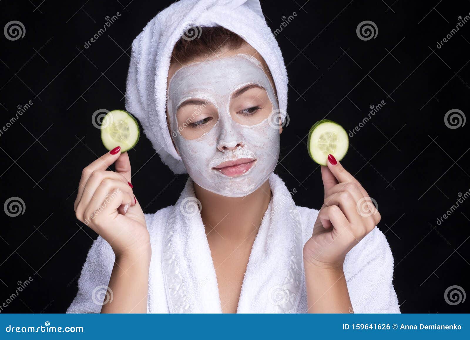 Beautiful Young European Woman Apply Clay Mask On Her Face With Towel