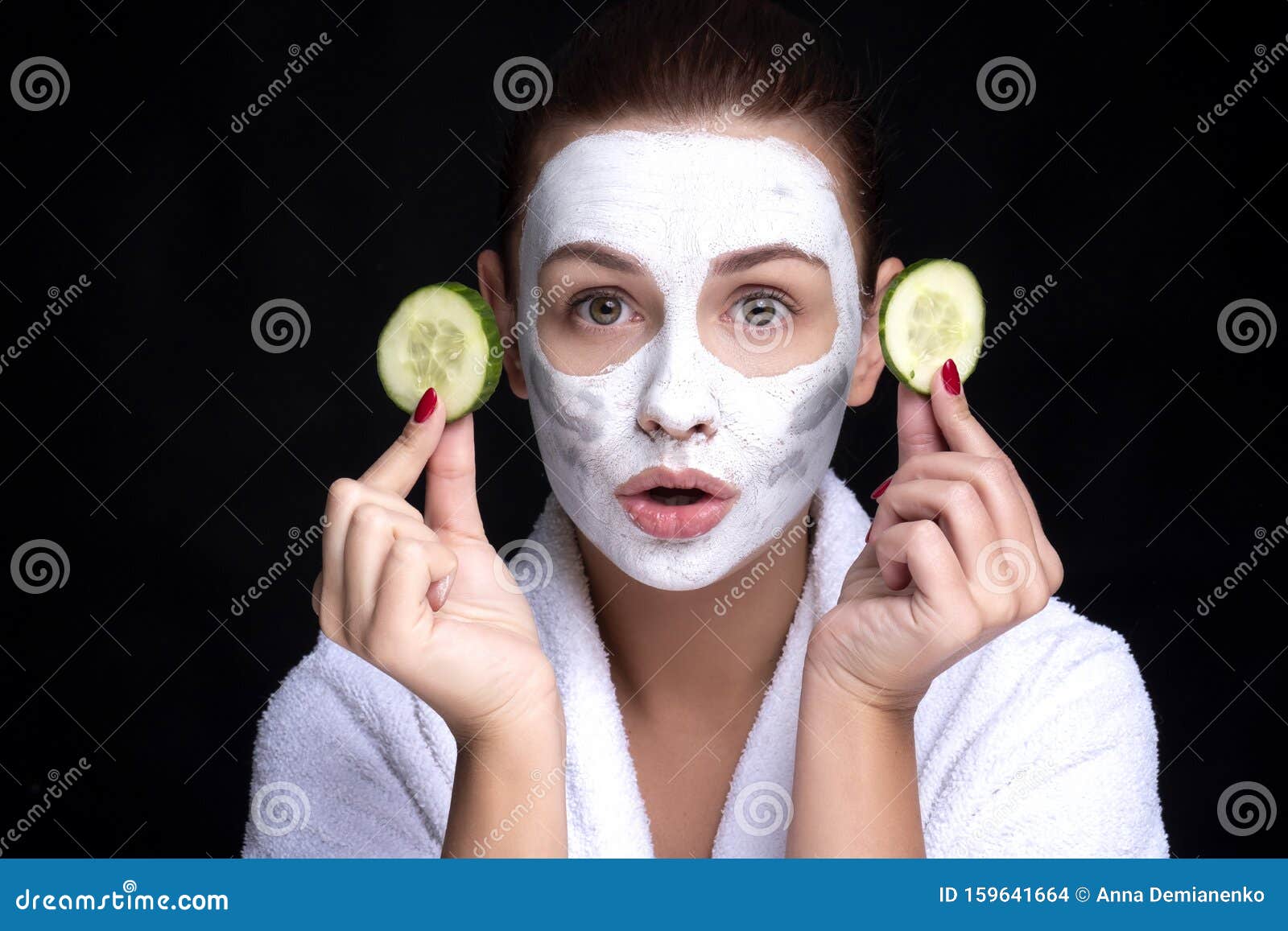 Beautiful Young European Woman Apply Clay Mask On Her Face With Towel
