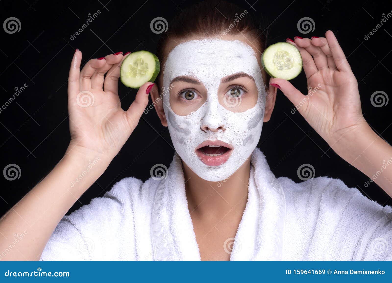 Beautiful Young European Woman Apply Clay Mask On Her Face With Towel