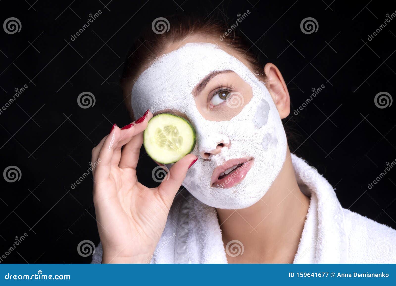 Beautiful Young European Woman Apply Clay Mask On Her Face With Towel