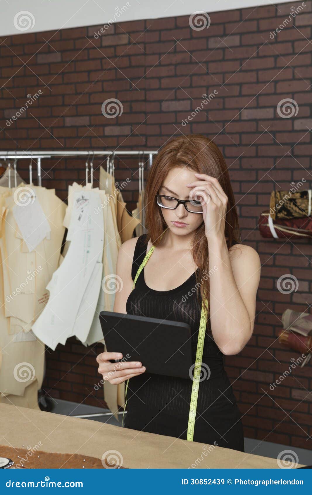 Beautiful Young Female Fashion Designer Using Tablet PC Stock Image ...