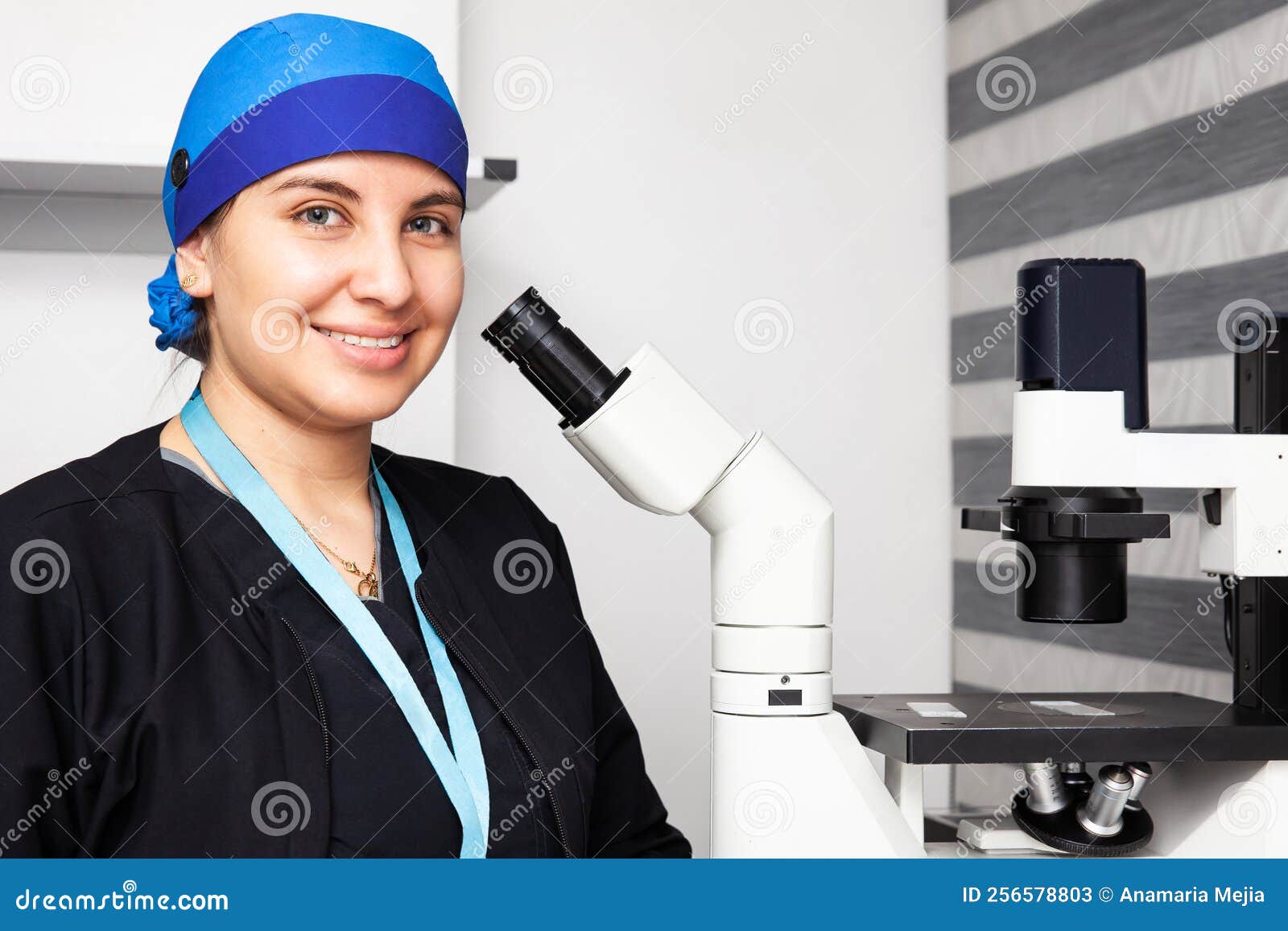 Beautiful Young Female Scientist in the Laboratory Next To an Inverted ...