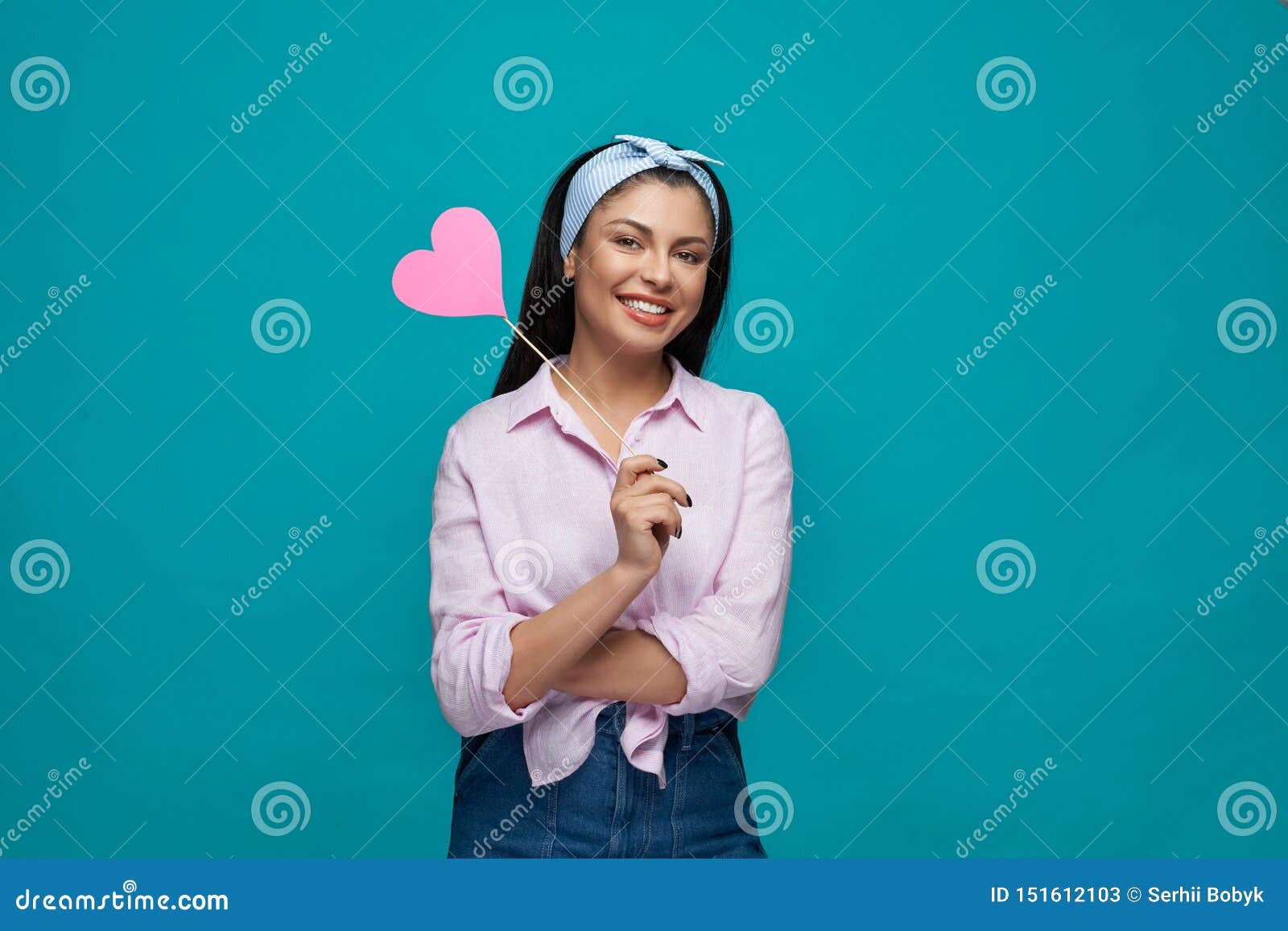 Beautiful Young Female In White Shirt And Jeans Posing Stock Image