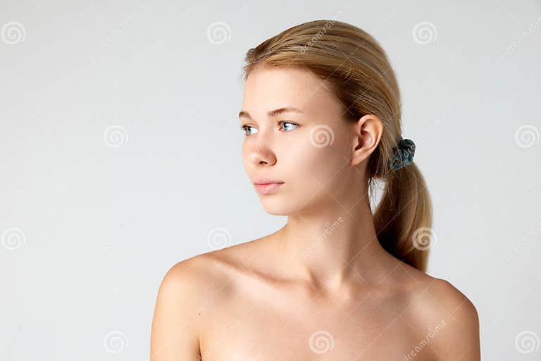 Beautiful Young Girl With Healthy Spotless Well Kept Skin Standing