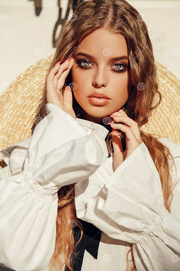 Beautiful Young Girl With Long Curly Hair Wears Elegant Straw Ha Stock