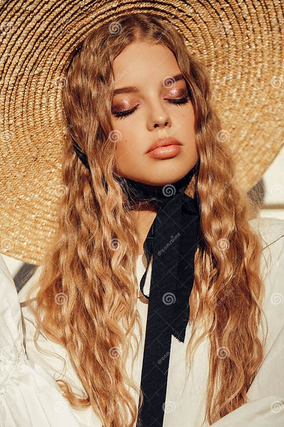 Beautiful Young Girl With Long Curly Hair Wears Elegant Straw Ha Stock