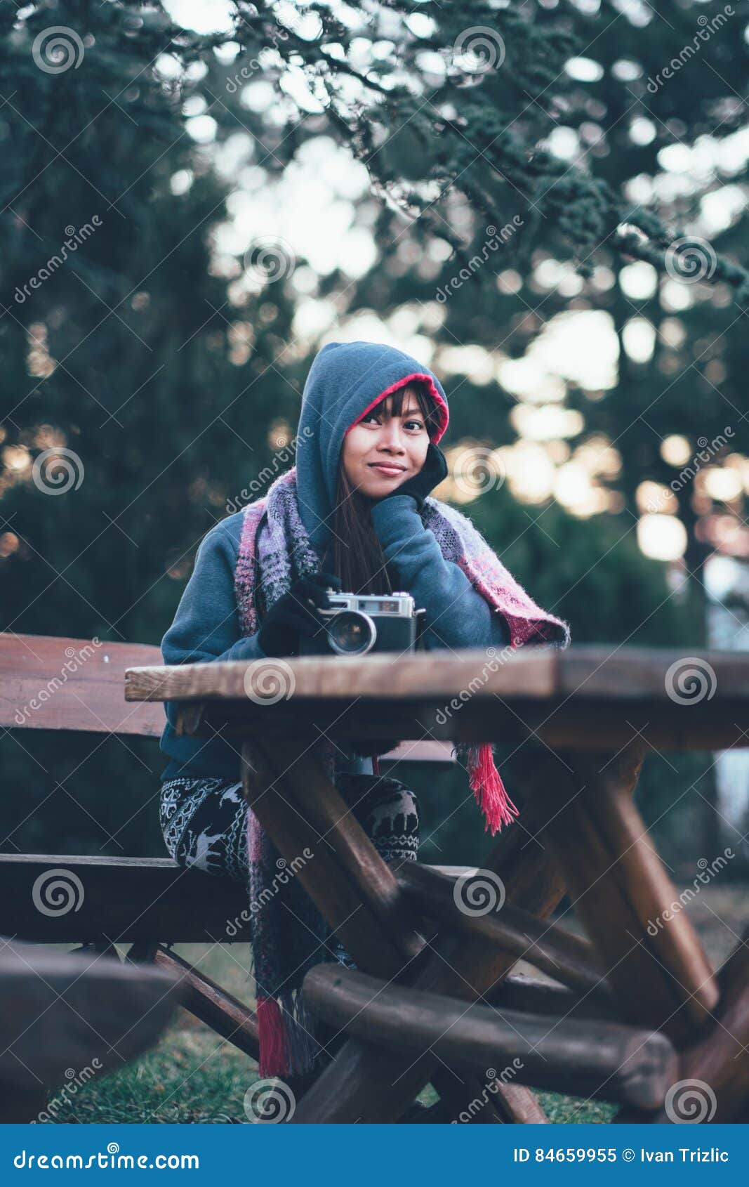 Beautiful Young Girl Outside Sitting with Camera on Table Stock Image ...