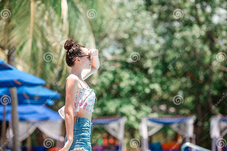 Beautiful Young Girl Relaxing Near The Swimming Pool Stock Image Image Of Happiness Jeans