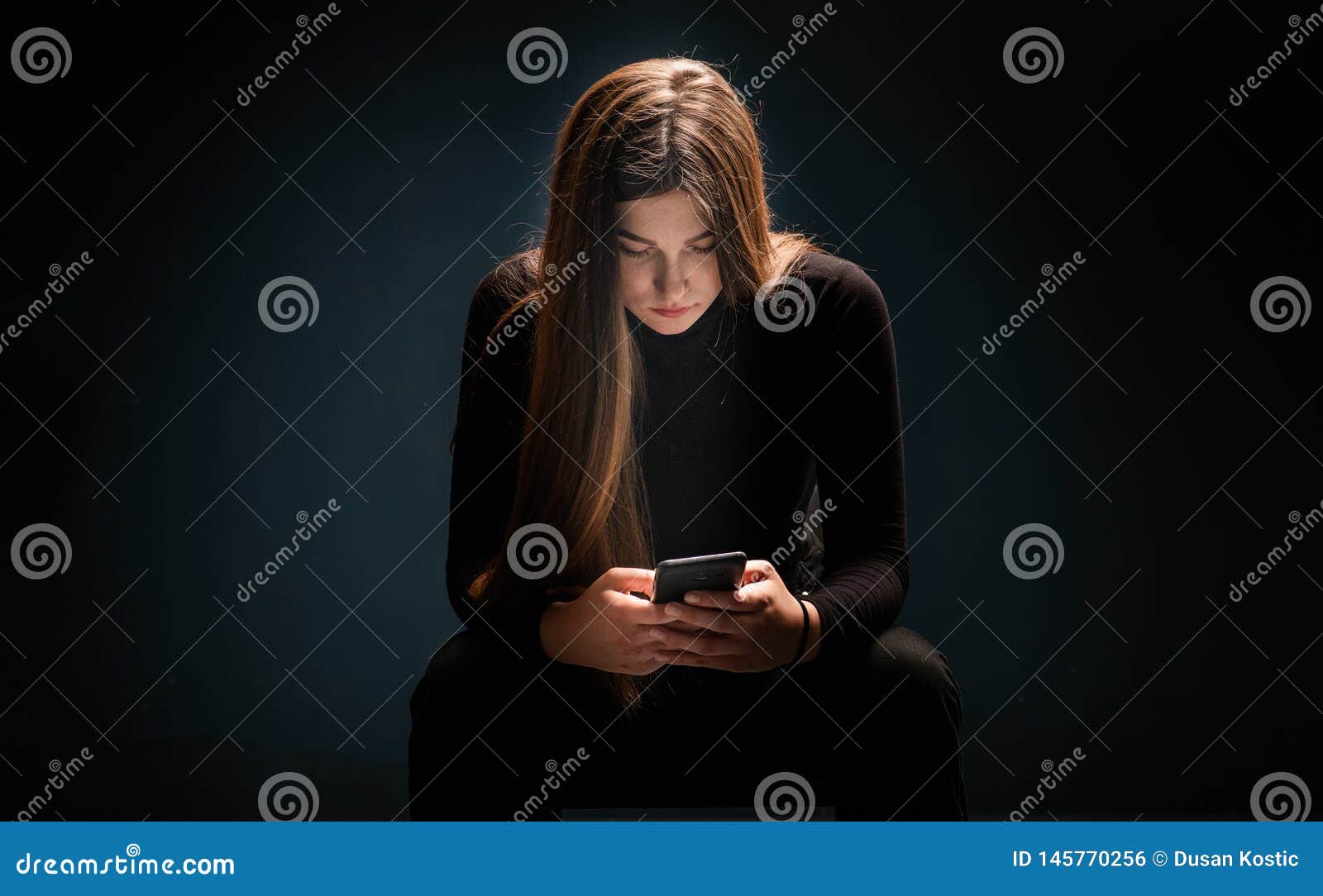 Beautiful Young Girl Using Her Mobile Phone Stock Photo - Image of ...