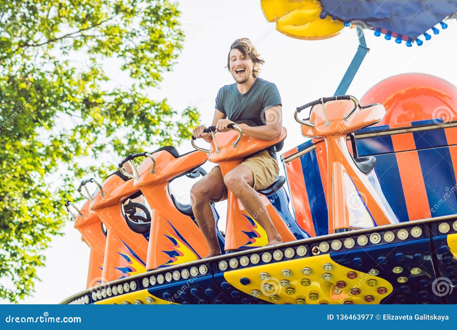 Beautiful, Young Man Having Fun at an Amusement Park Stock Image ...