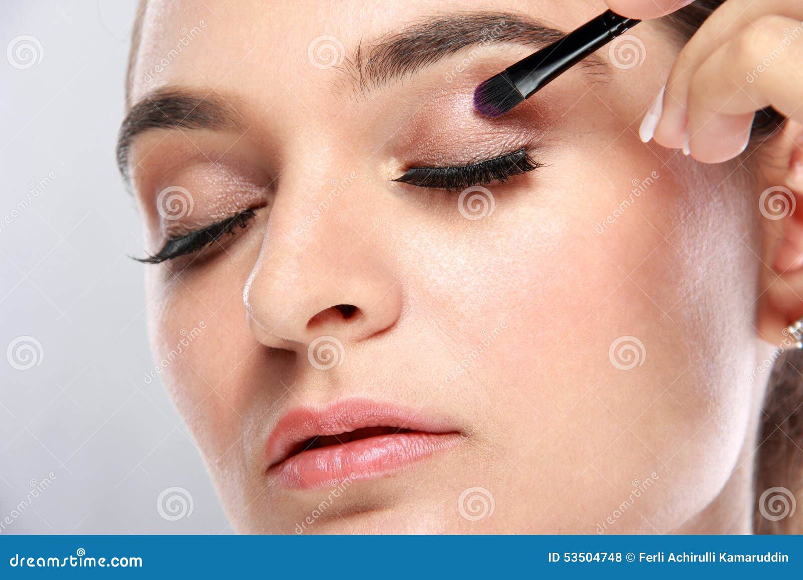 Beautiful Young Model Applying Some Eyeshadow Stock Photo - Image of ...