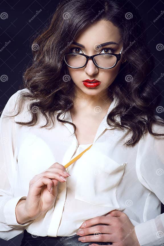 Beautiful Young Business Woman With Dark Wavy Hair And Red Lips Wearing