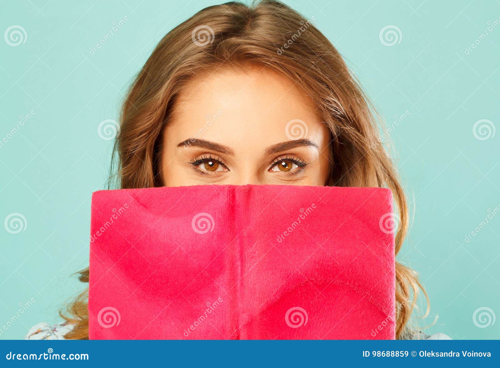Beautiful Young Student Holding Book in Front of Her Face Over B Stock ...