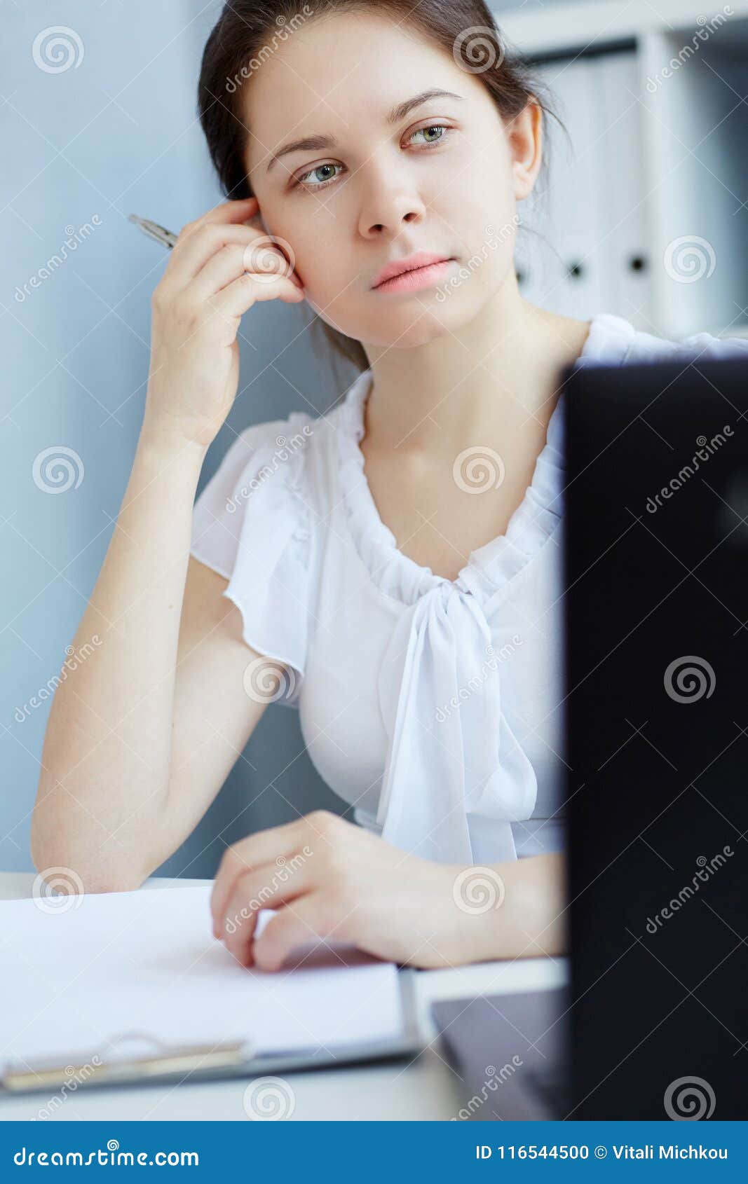 Beautiful Young Female Student or Intern Working on a Laptop in the ...