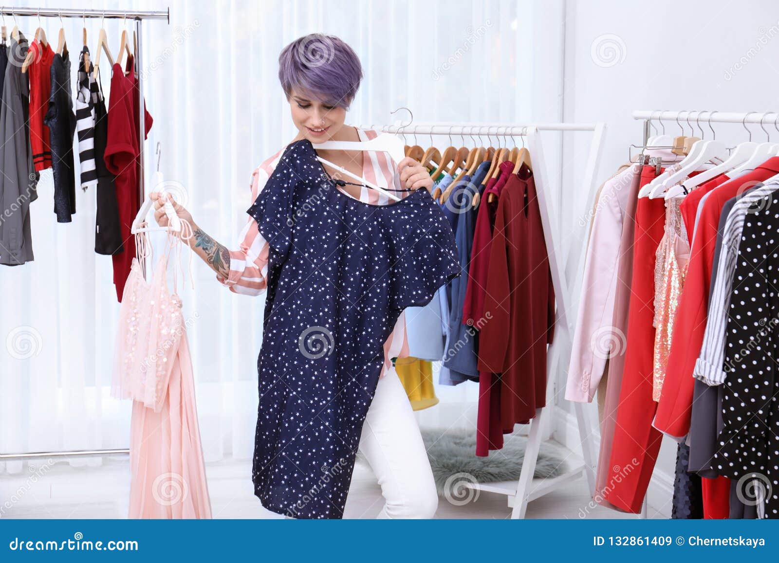 Beautiful Young Stylist Choosing Clothes Stock Image - Image of ...