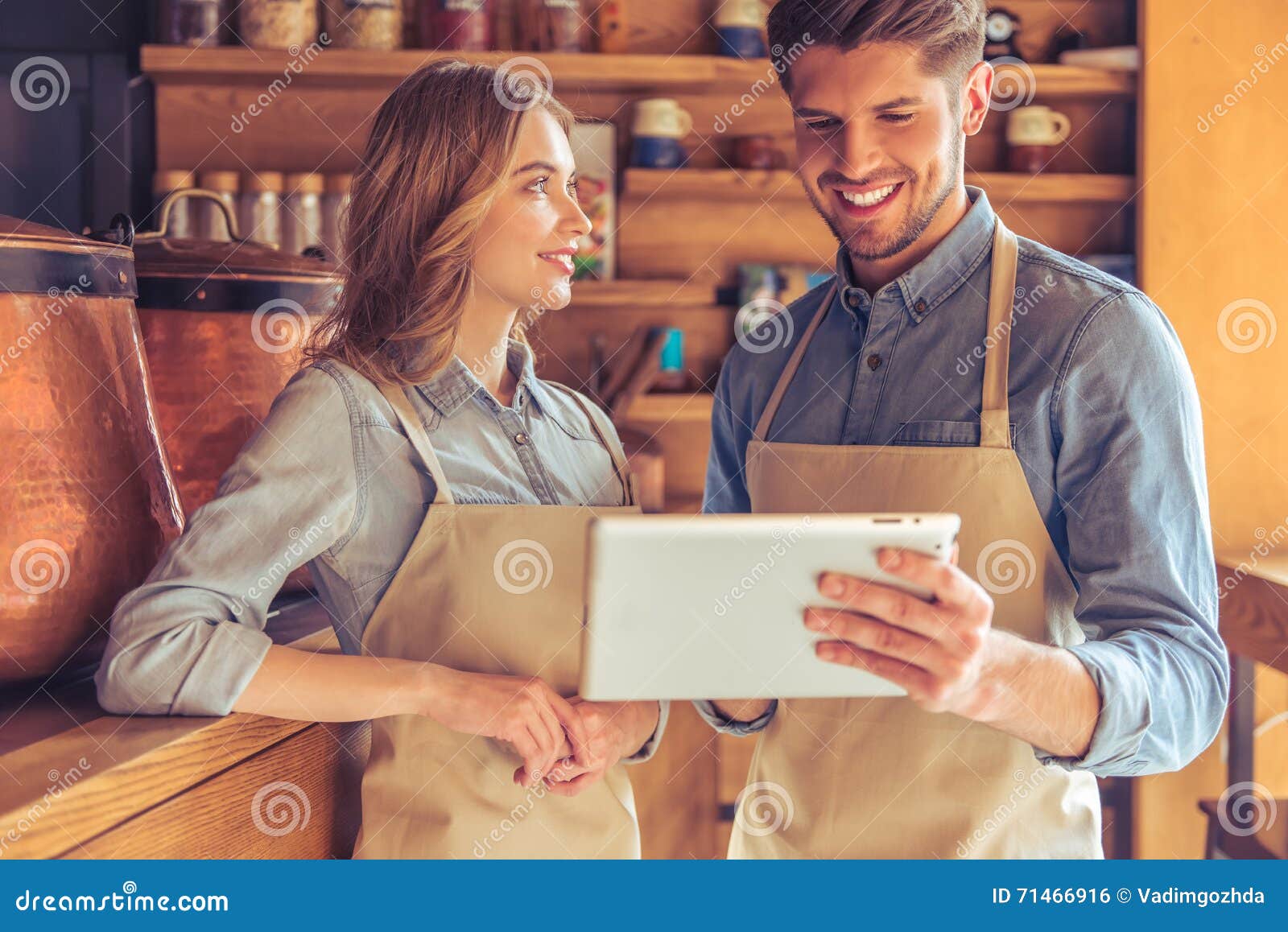Beautiful Young Waiters with Gadget Stock Photo - Image of shop, cafe ...