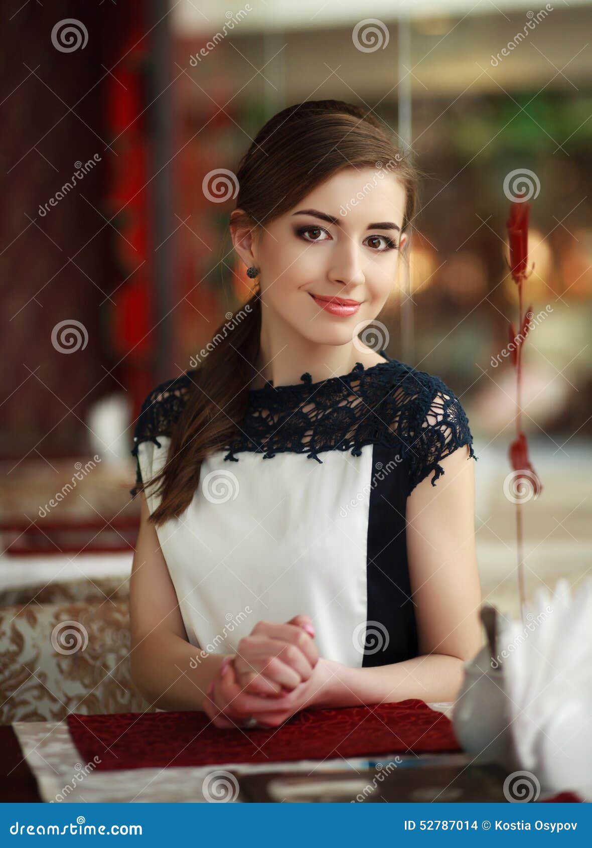 Beautiful Young Woman Alone Waiting at a Table in Restaurant Stock ...