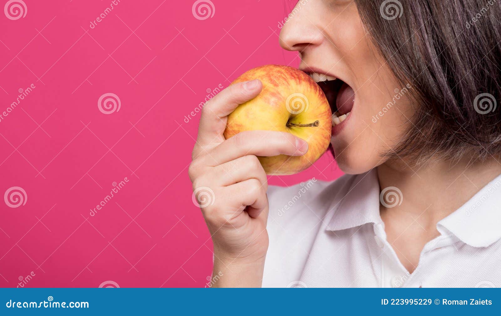Beautiful Young Woman Bites a Big Apple. Stock Image - Image of eating ...