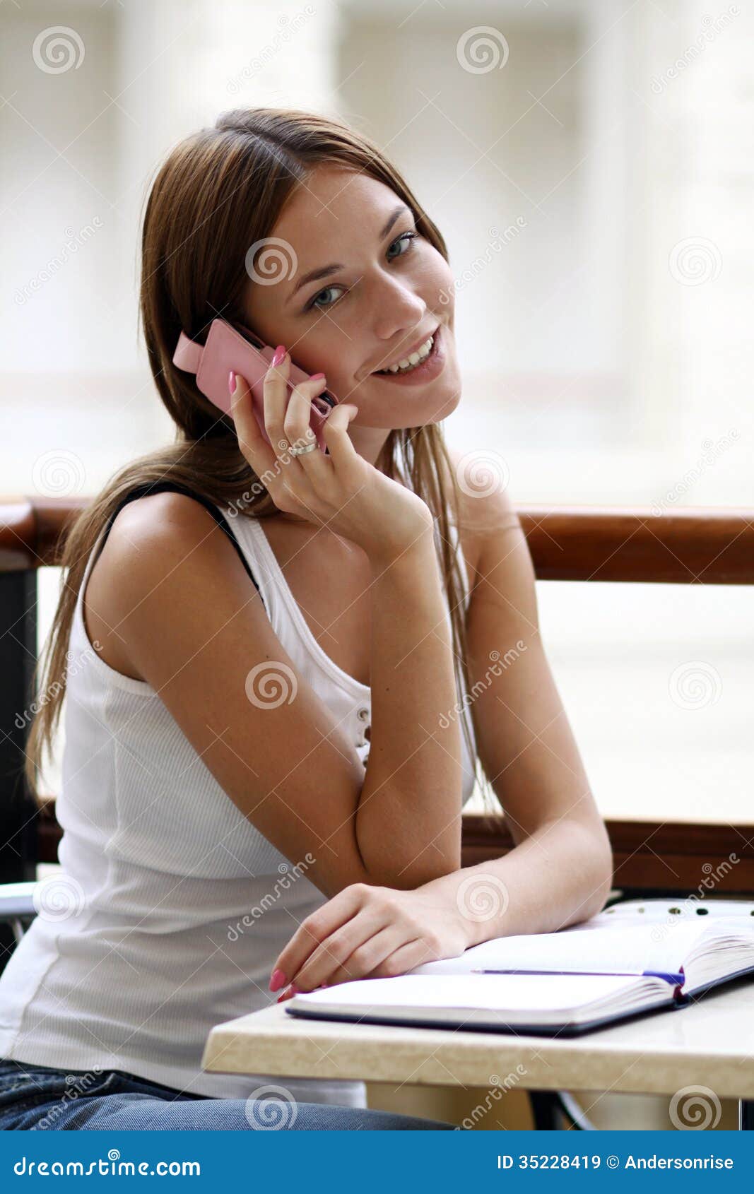 Beautiful young woman stock image. Image of cellphone - 35228419